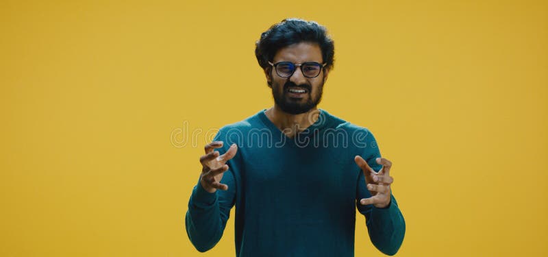 Young man angrily grasping stock image. Image of nervous - 169537109