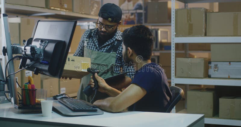 Young Man Working in Distribution Center Stock Photo - Image of working ...