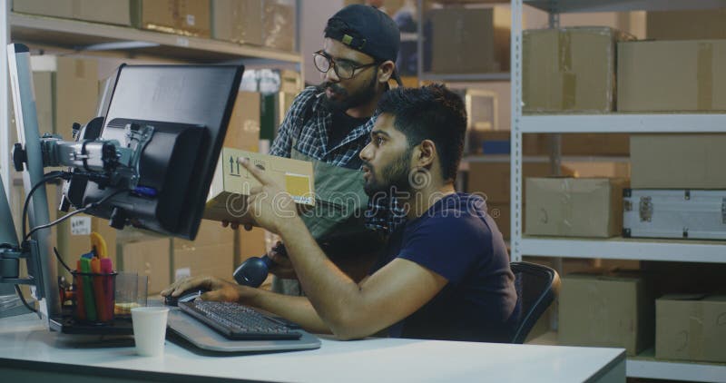 Young Man Working in Distribution Center Stock Image - Image of indian ...