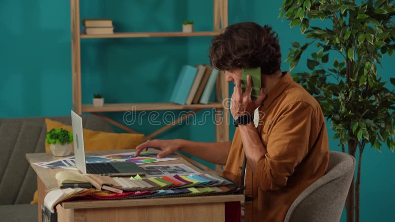 Medium Shot Capturing a Man Working in His Home Office. Young Designer ...