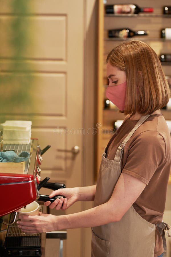 Young Woman Making Coffee stock photo. Image of mask - 244081244