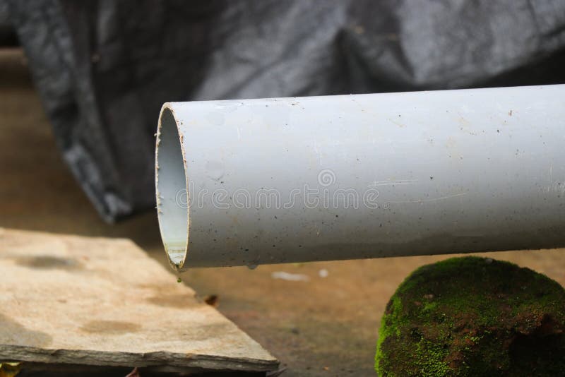 Medium Size PVC Pipe or Hose Used As Water Drainage with a Close View ... Medium Size PVC Pipe or Hose Used As Water Drainage with a Close View ...