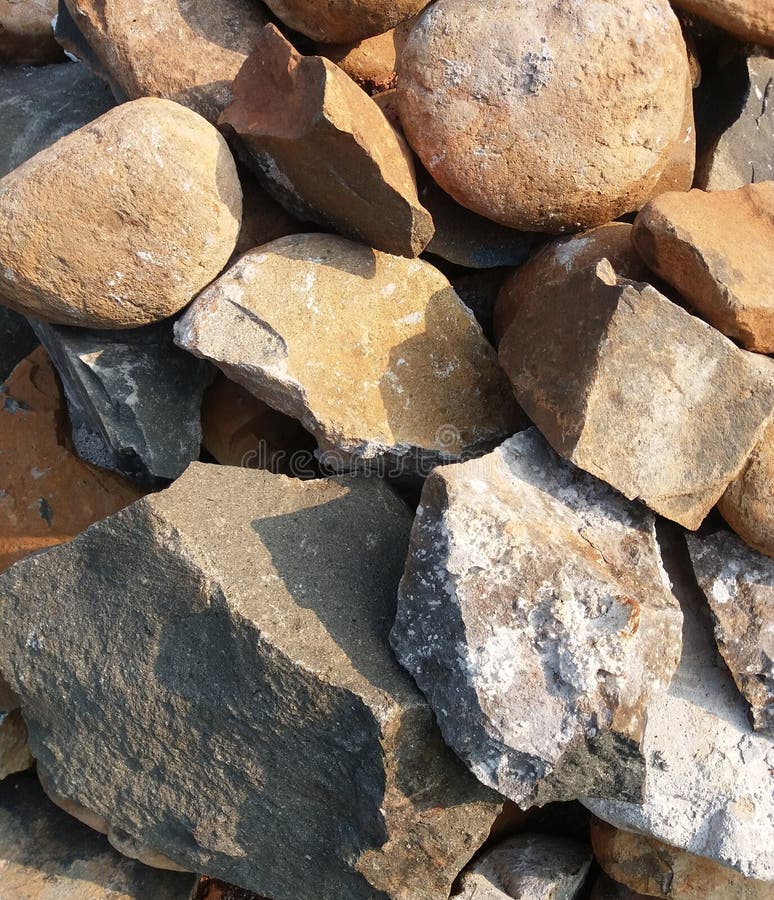 Medium-sized Piles of River Stones for House Foundations Create Unique ...