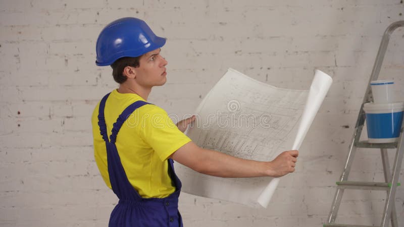 Medium Video of a Confused Young Construction Worker Looking at the ...