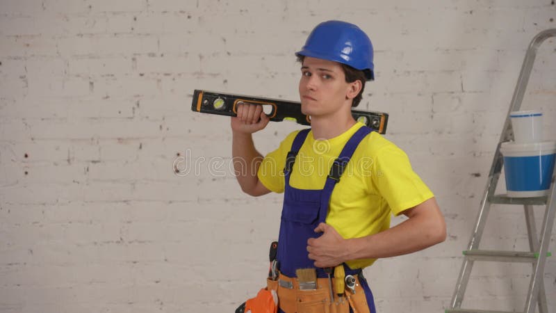 Medium Video of a Smiling Young Construction Worker Wearing a Tool Belt ...