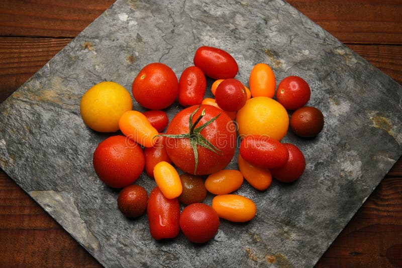 Medley Tomatoes on Slate stock photo. Image of pile, yellow - 69128984