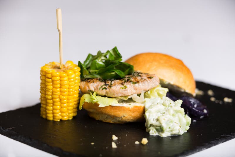 A Meet Burger Served with Cheese and Vegetables Stock Image - Image of ...