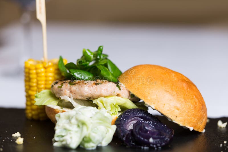 A Meet Burger Served with Cheese and Vegetables Stock Image - Image of ...