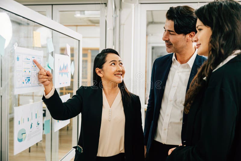 Team Collaboration Around Whiteboard Business Strategy Discussions ...