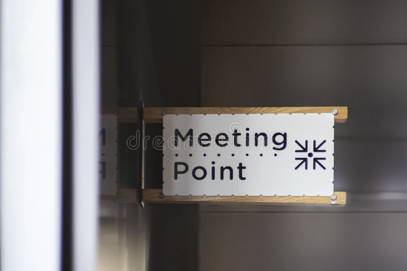 Meeting Point Sign in the Building Stock Image - Image of arrow, gather ...