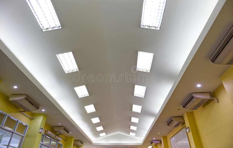 A Meeting Room with Rows of Ceiling Light Boxes and Air Conditioners ...