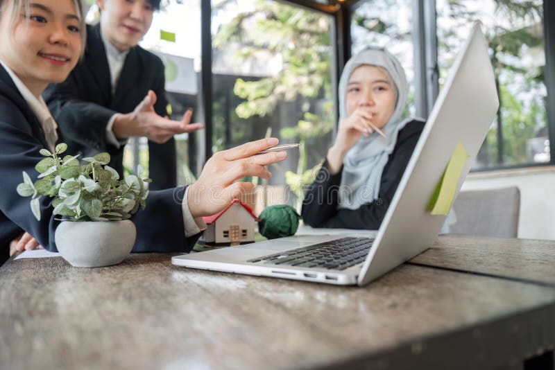 Engaged Team and Eco-Friendly Solutions. Colleagues Discussing a ...