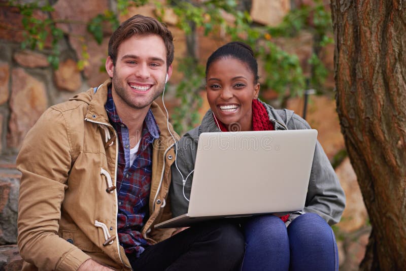 Meeting Up between Classes. a Young Couple Using a Laptop Together on ...