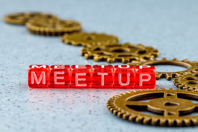 Meetup Written on Red Cubes Background Blurred Gears for the Mechanism ...