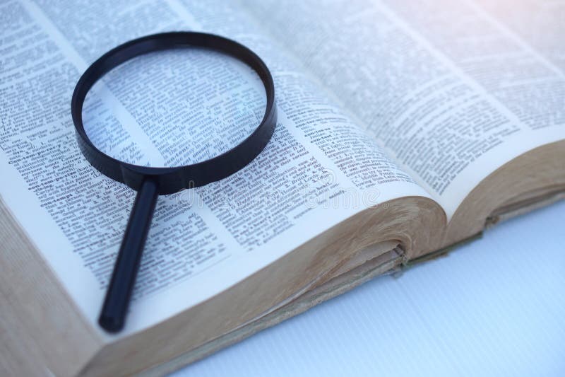 Megnifying Glass on Page of Dictionary. Stock Image - Image of ...
