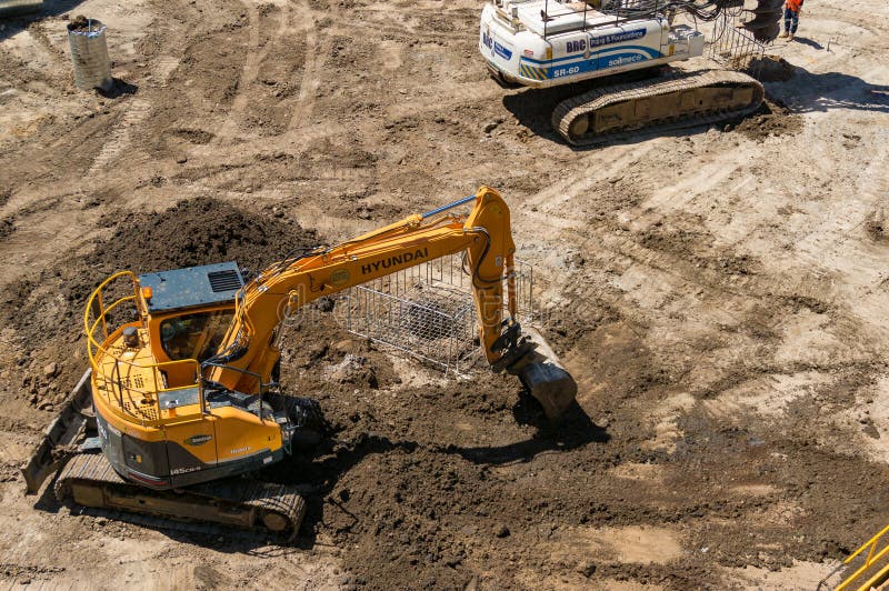 Construction Site with Excavator Digging Earth Editorial Photography ...