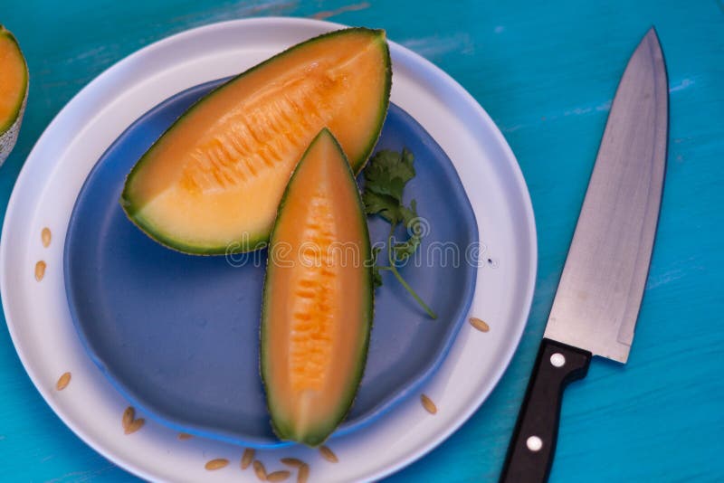 Melon on Blue Table, with Plate Blue and White Stock Image - Image of ...