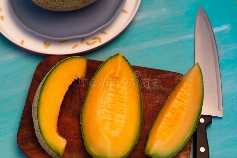 Melon on Blue Table, with Plate Blue and White Stock Image - Image of ...