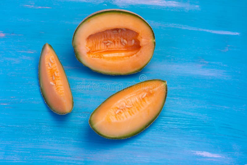 Melon on Blue Table, with Plate Blue and White Stock Image - Image of ...