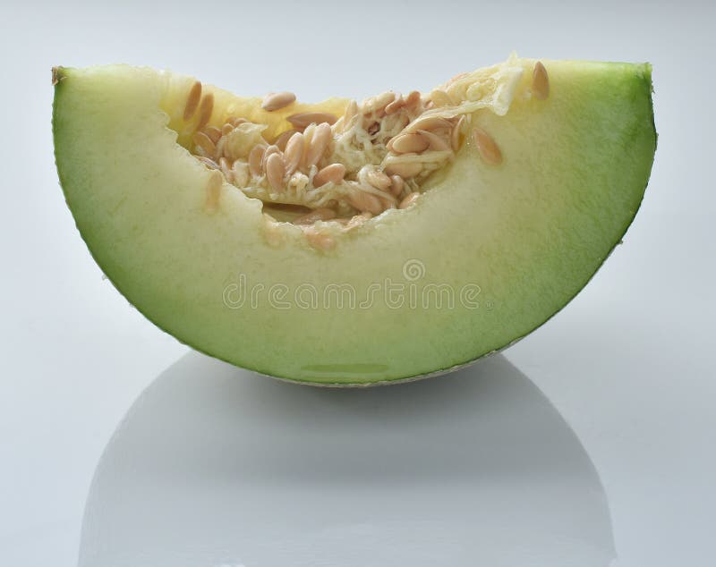 Melon Cut in Half on a White Background Stock Photo - Image of juicy ...