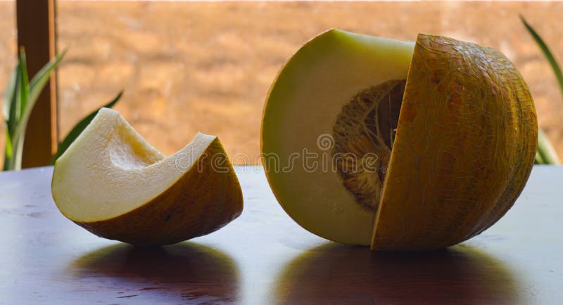 Melon is cut with a knife stock image. Image of colorful - 229068731