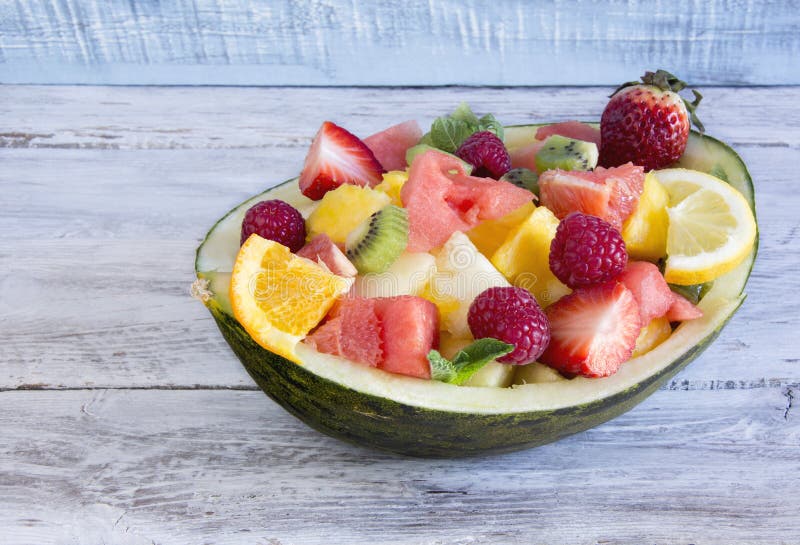 Melon Stuffed with Mixed Fruit Stock Photo - Image of colorful ...