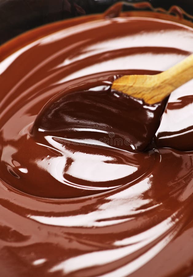 Melted chocolate and spoon stock image. Image of delicious - 12665409