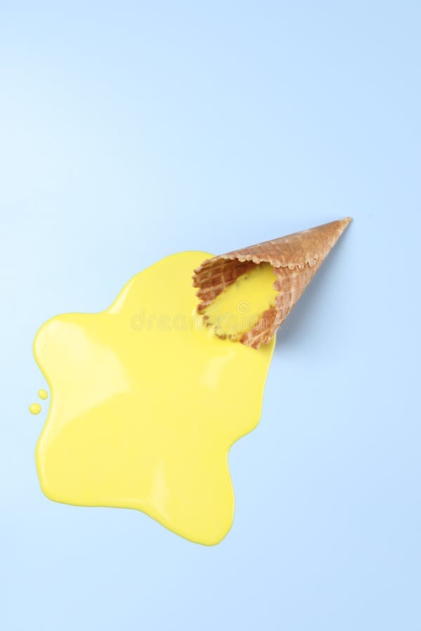 Melted Ice Cream and Wafer Cone on Light Blue Background, Top View ...