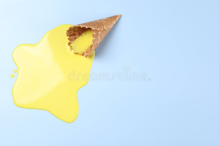 Melted Ice Cream and Wafer Cone on Light Blue Background, Top View ...