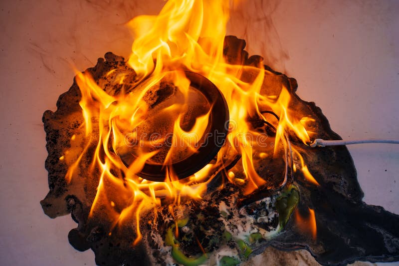 A Melted Plastic Electric Kettle Engulfed in Flames Stock Image - Image ...