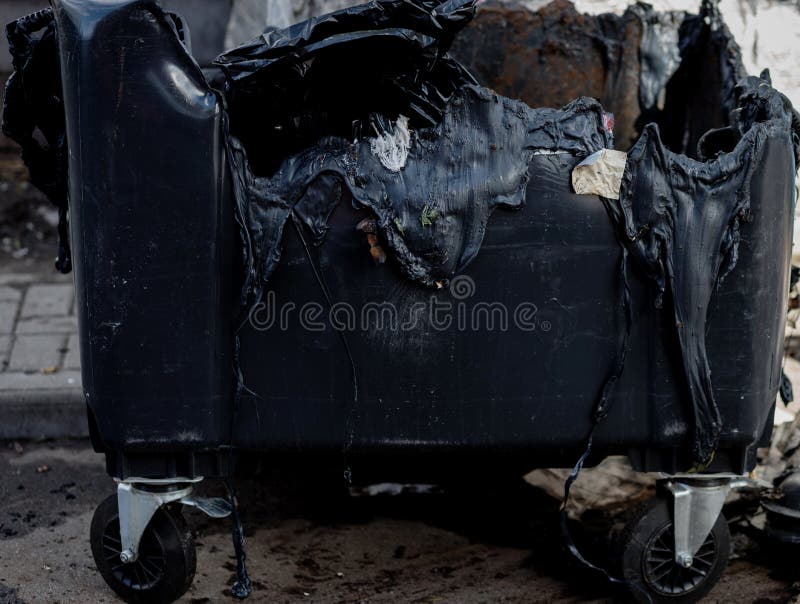 Melted trash can from fire stock photo. Image of household - 234049484