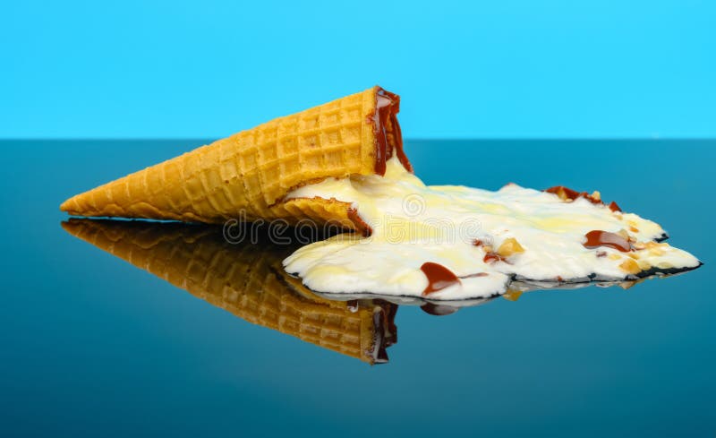 A Melted Vanilla Flavor Ice Cream Cone on a Glass with Reflection Stock ... A Melted Vanilla Flavor Ice Cream Cone on a Glass with Reflection Stock ...