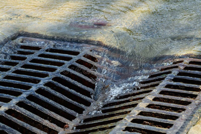 Melted Water Flows Down through the Manhole Stock Image - Image of city ...