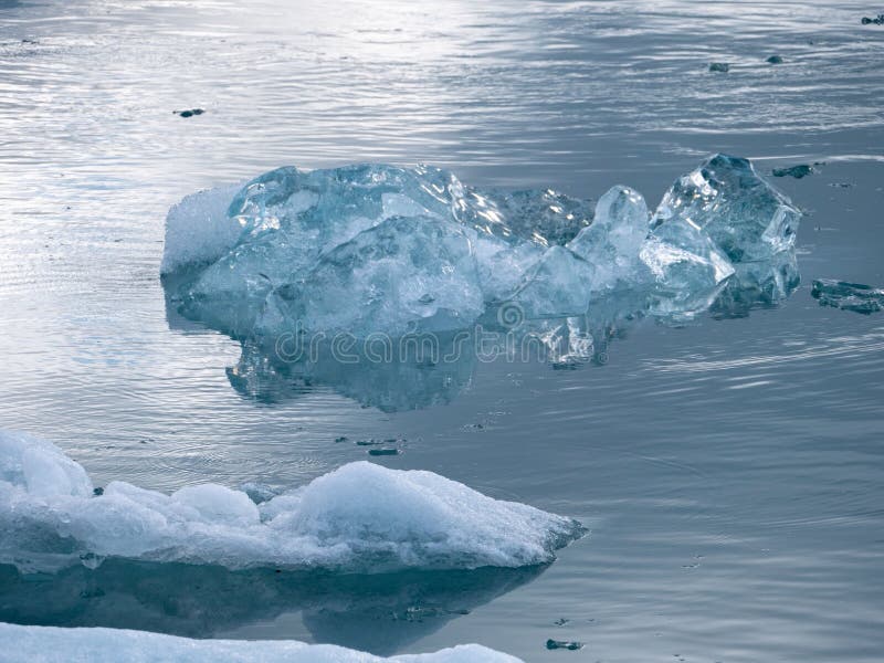 Melting Blue Ice Floating on Top of the Water Stock Image - Image of ...