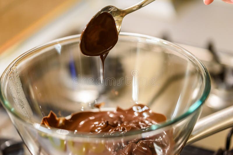 Melting Chocolate on Stove stock image. Image of drip - 84712875