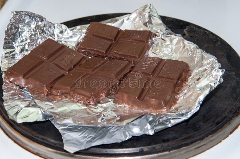 Melting Cooking Chocolate on the Paper Stock Photo - Image of ...