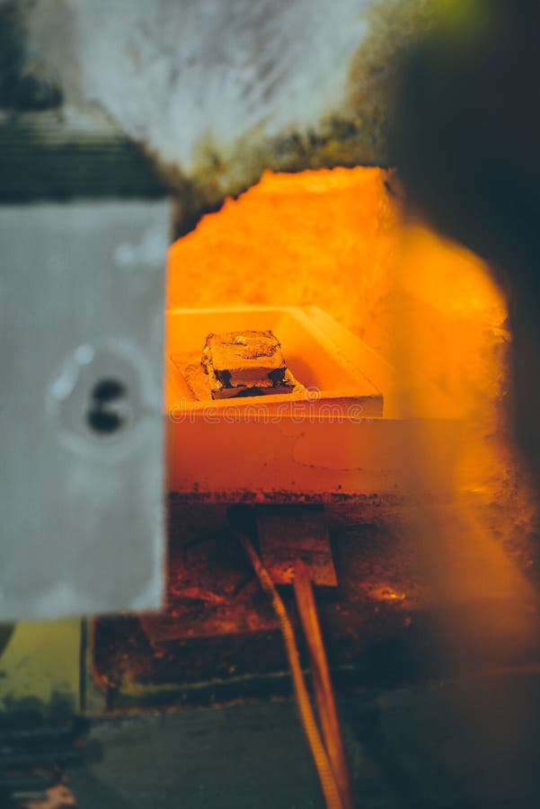 Melting gold at a mill stock photo. Image of melt, industrial - 95550162