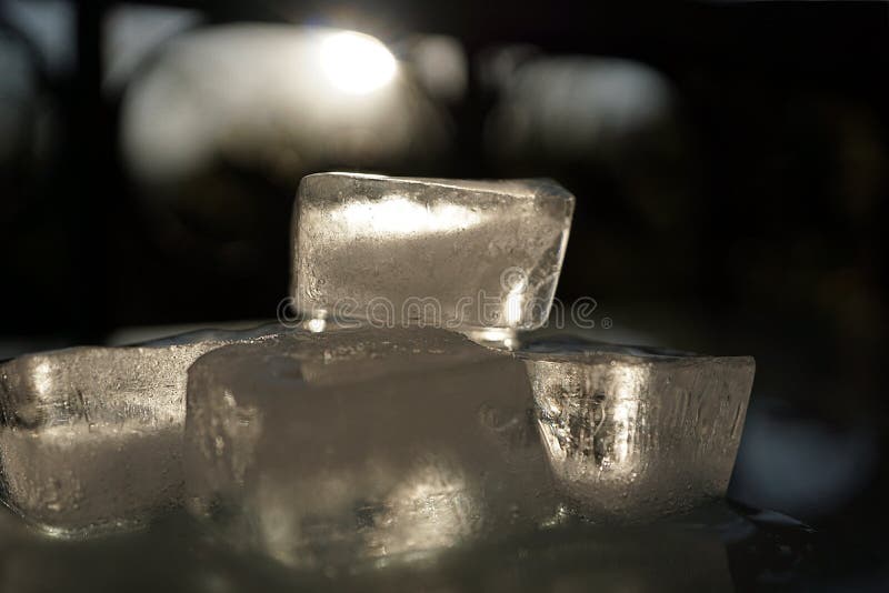 Melting Ice Cubes Close Up stock photo. Image of reflection - 138957480