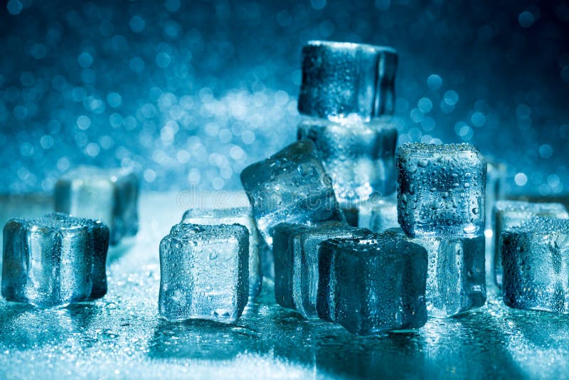 Melting Ice Cubes on a Wooden Table. Close-up Stock Image - Image of ...