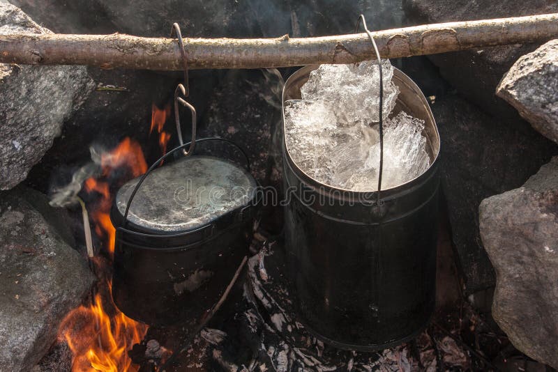 Melting ice in a pot stock image. Image of camp, kettle - 91978949