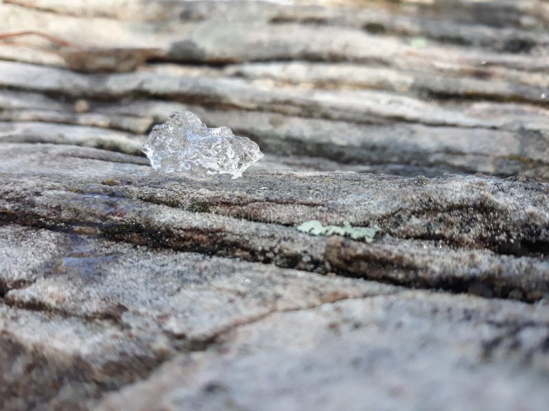 Melting ice on rock stock photo. Image of snow, rock - 170531232