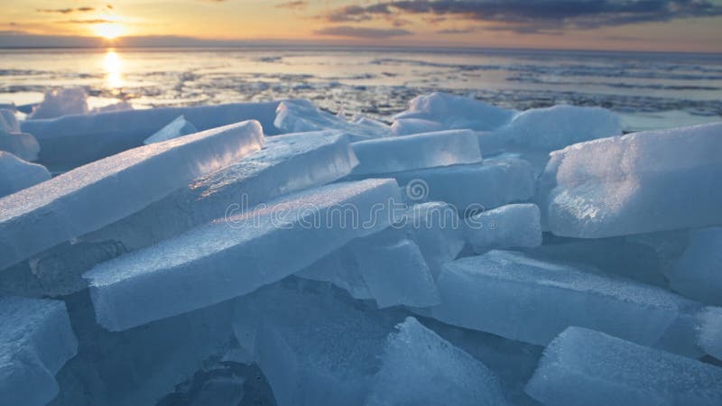 Melting Ice in Spring. Crashed Ice in the Rays of the Setting Sun. Blue ...