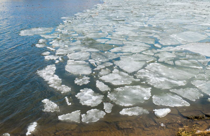Melting ice on spring lake stock image. Image of lake - 69417419