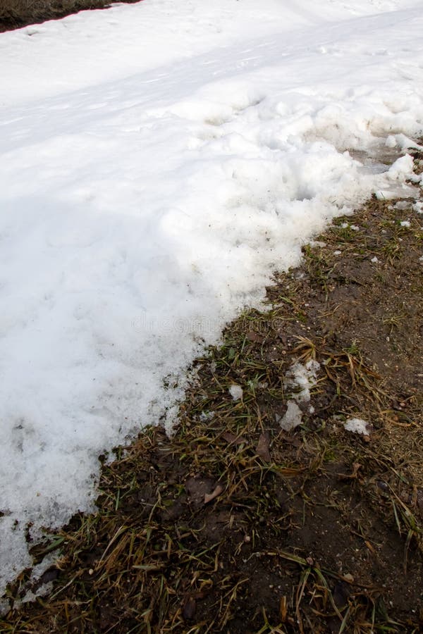 Melting Snow on Side of Road by Curb Stock Image - Image of drainage ...