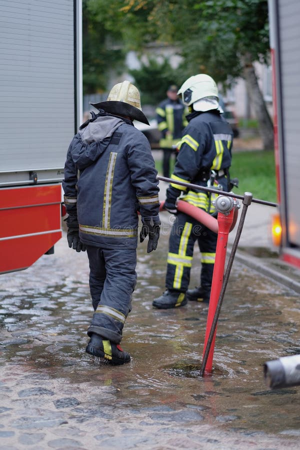 Members of the Fire Brigade Editorial Image - Image of helmet, blurred ...