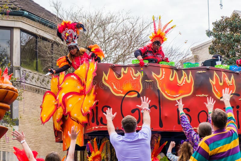 Members Of Mardi Gras Krewe Throw Beads Off Of Parade Float Editorial