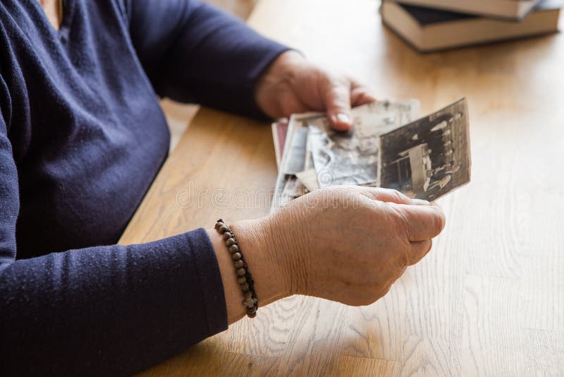 Memory. Eldery Woman Looking Vintage Photos Stock Photo - Image of ...