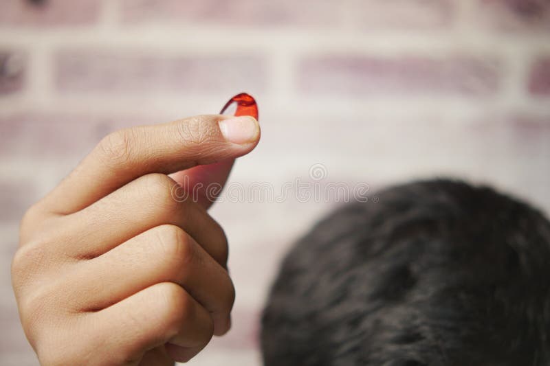 Men Applying Capsule Oil on Hair Stock Photo - Image of adult ...