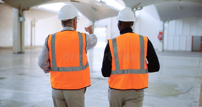 Men, Architect and Talk with Point at Warehouse, Engineering and ...