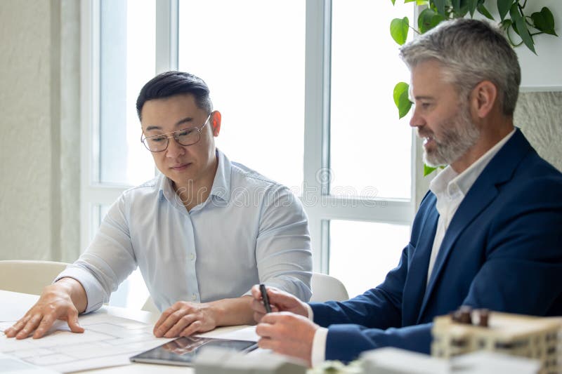 Men Architects Working on Construction Plans, Engineers Discussing on ...